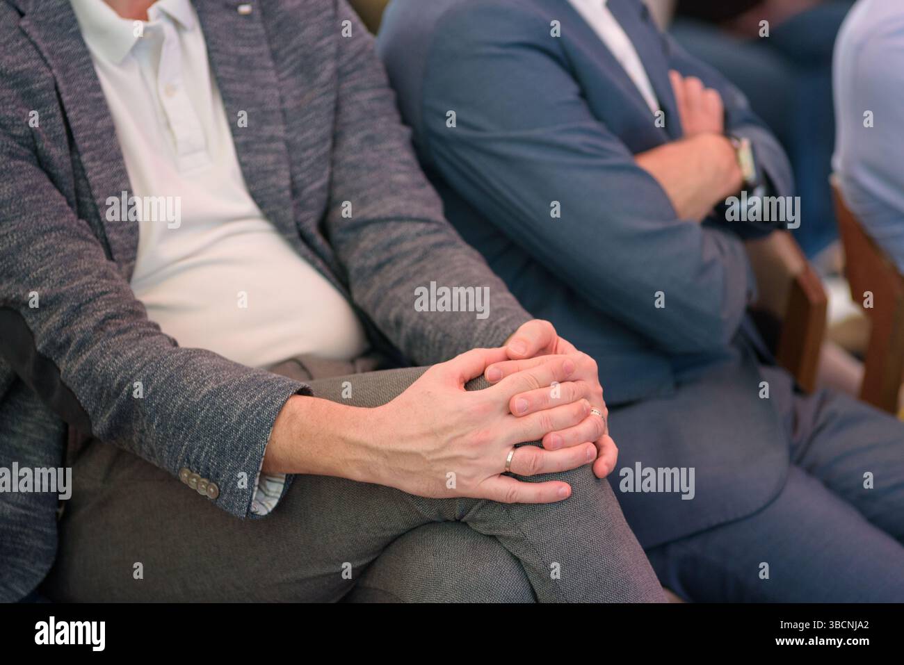 Businessmen body language during business meeting Stock Photo - Alamy