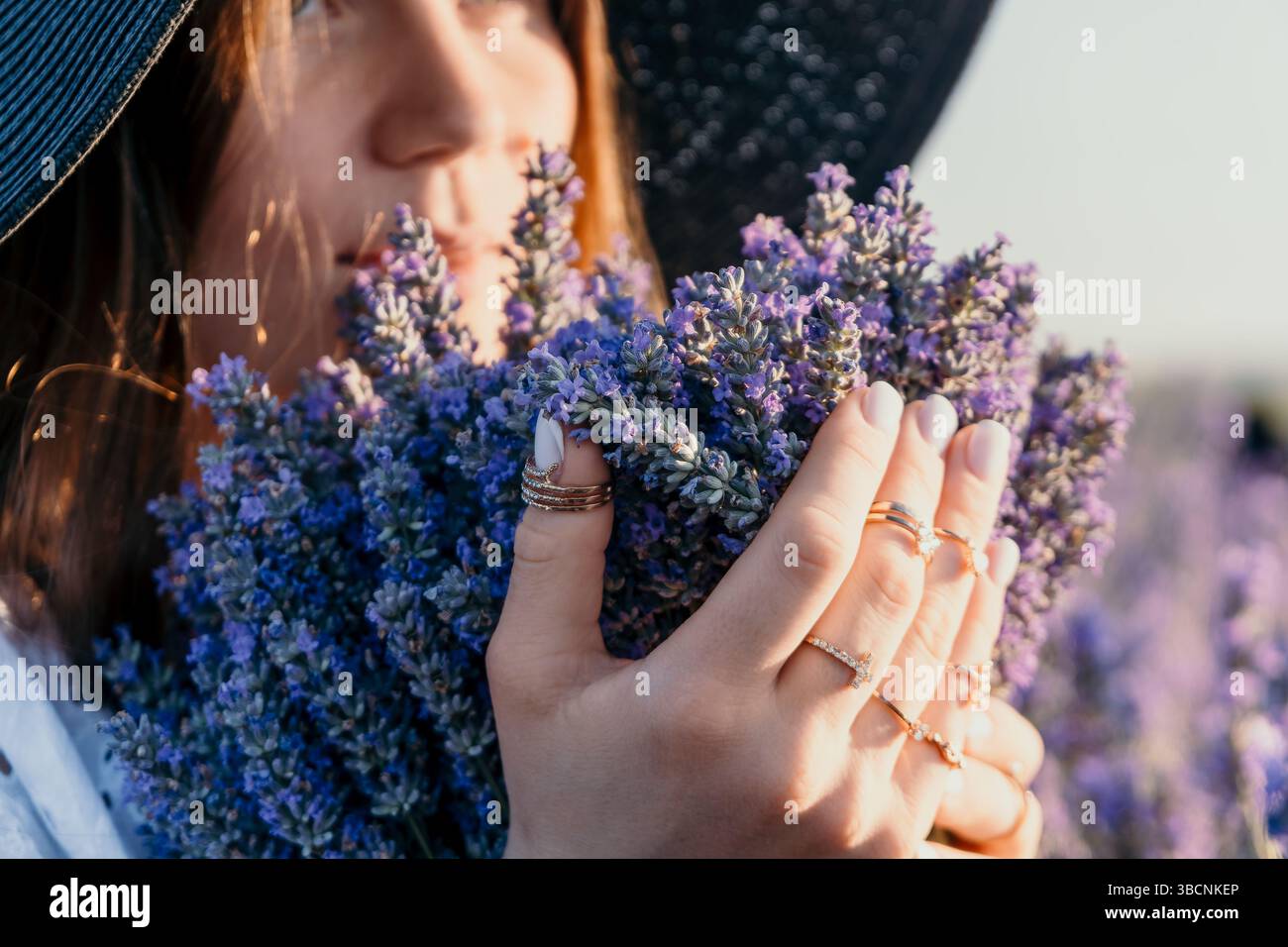 Beautiful woman sniffing bouquet hi-res stock photography and images ...