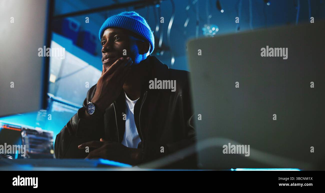 Black man, hacker and thinking with computer at night for programming ...