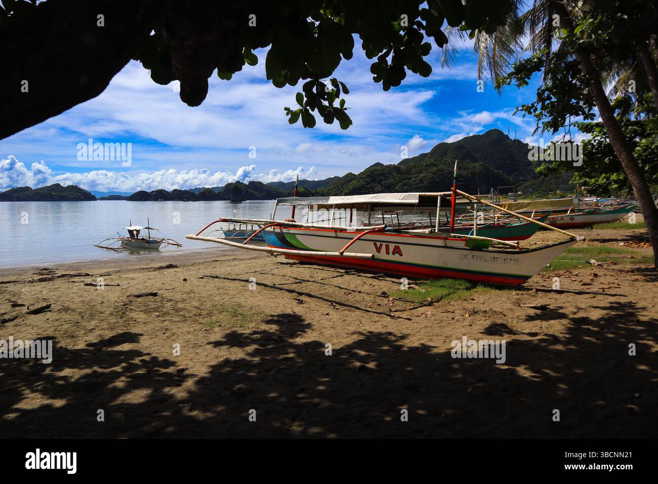 Boats sit idly at the Paniman Beach, Caramoan Peninsula, Camarines Sur ...