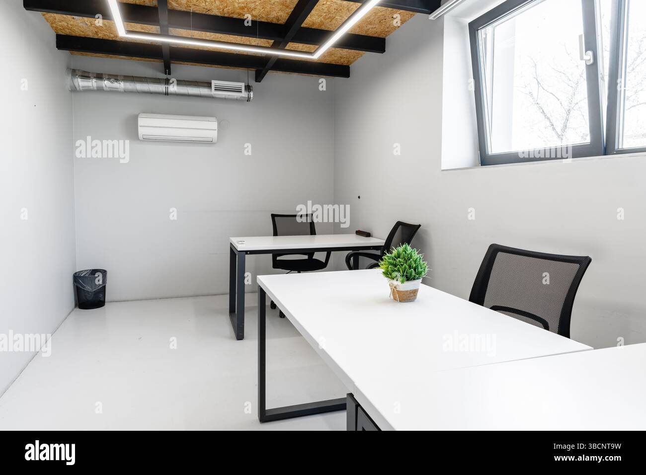 Modern office space with minimal design and natural light during ...