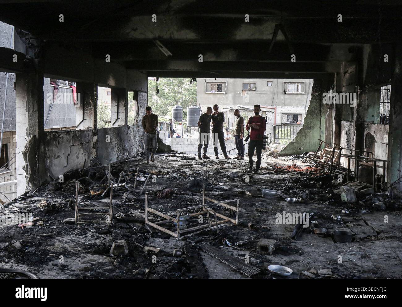 Gaza. 20th May, 2025. Palestinians check damage after an Israeli ...