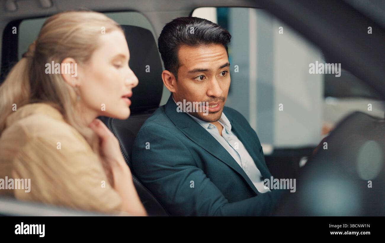 Car salesman explaining vehicle details hi-res stock photography and ...