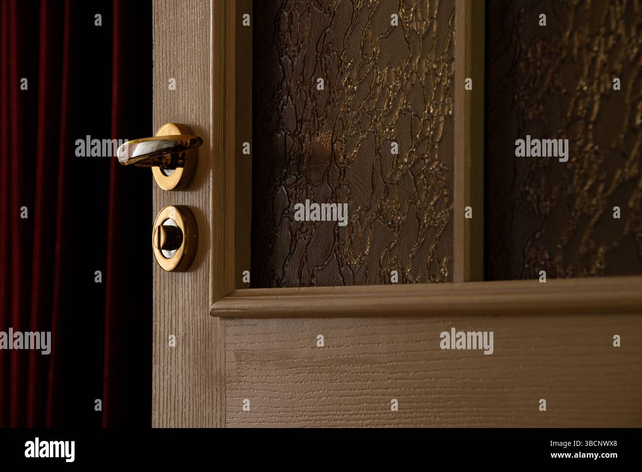 Open interior door with glass inserts in the bedroom in the apartment ...
