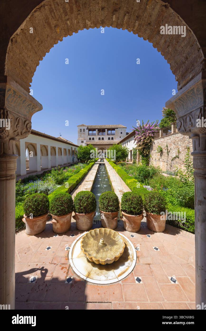 Ornamental garden with a central fountain and a long water channel in ...