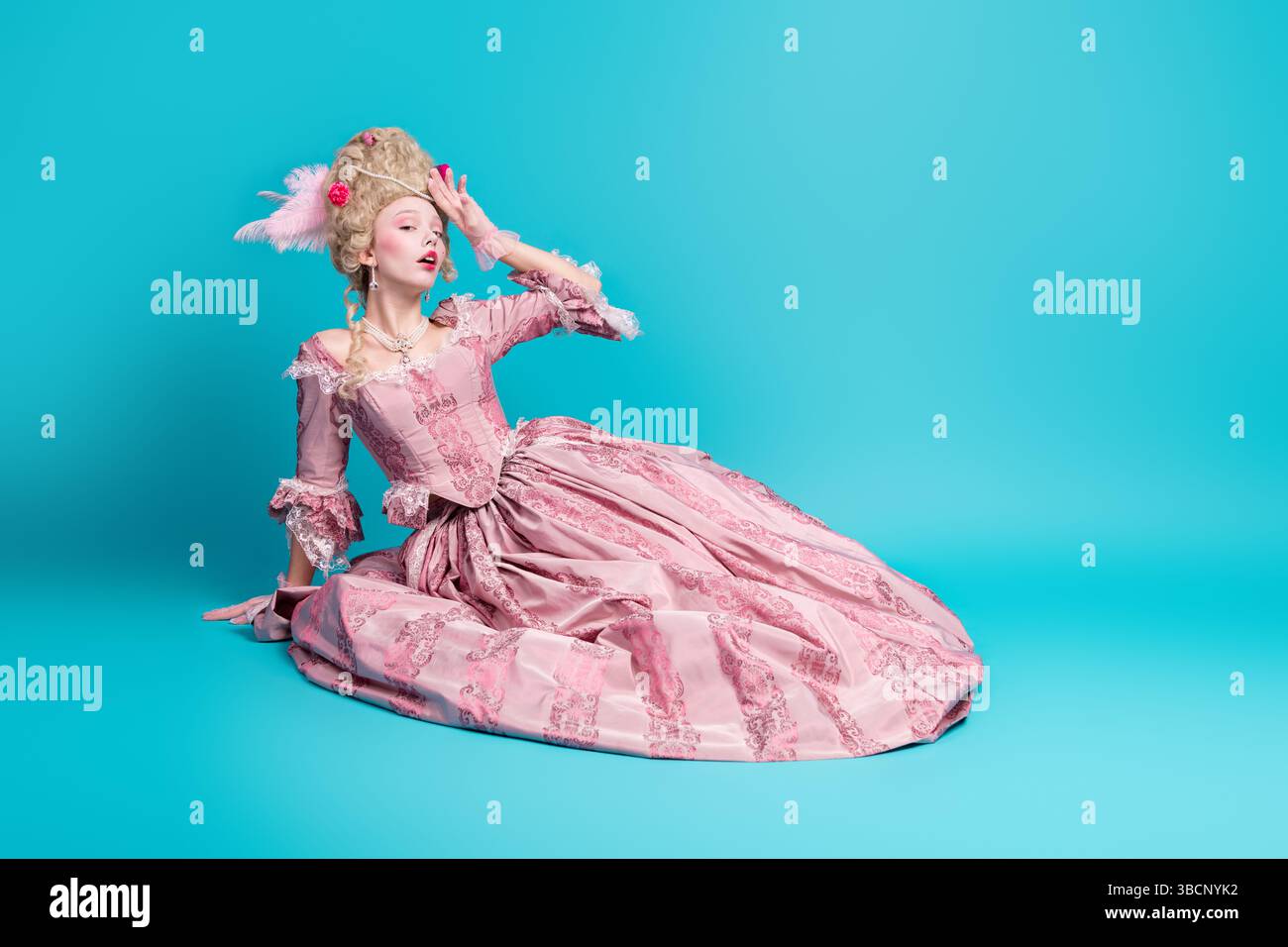 Photo of charming tired princess wear pink ruches gown sit floor faint ...
