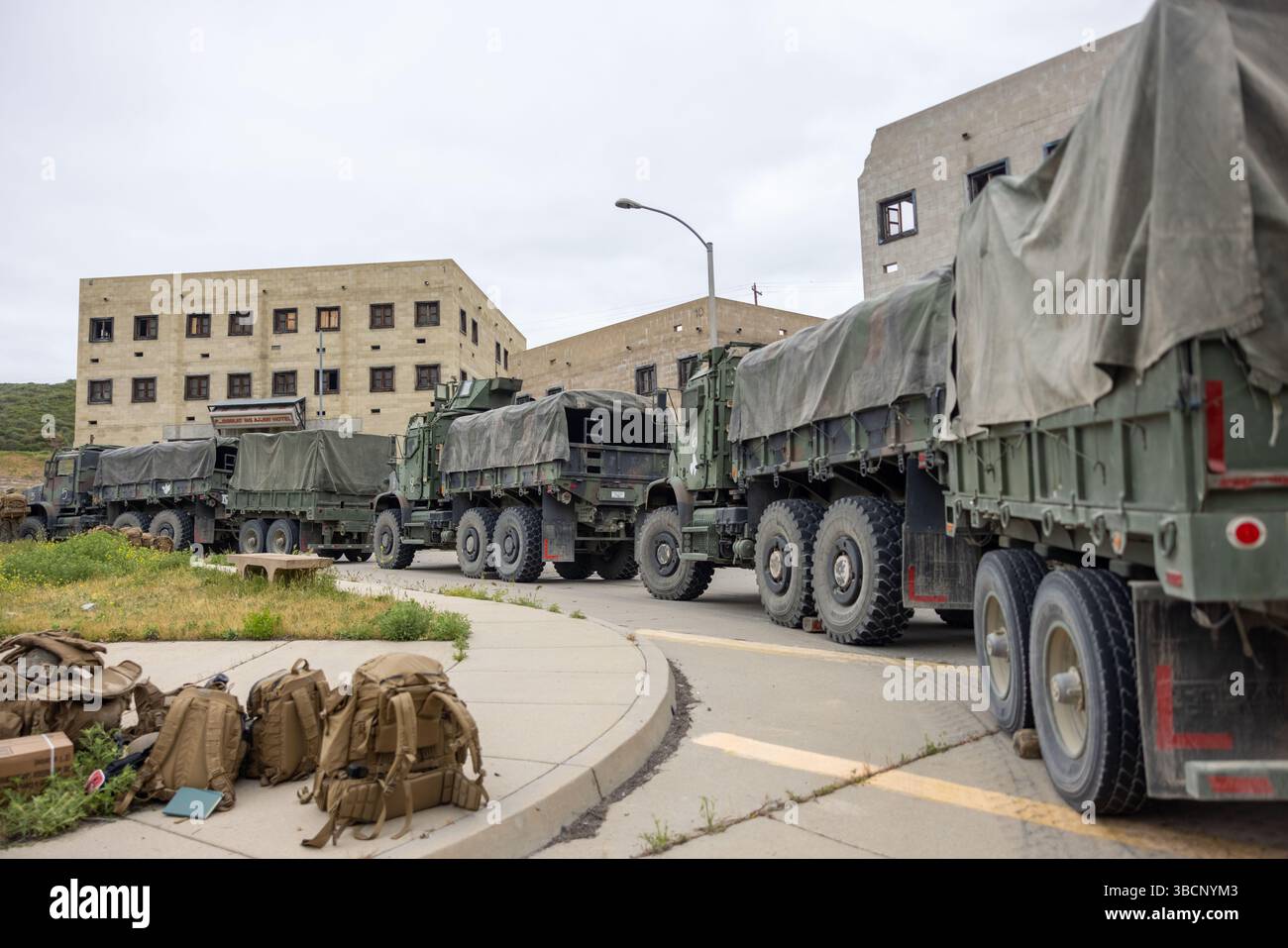 U.S. Marines with 1st Marine Division arrive at a secondary location ...