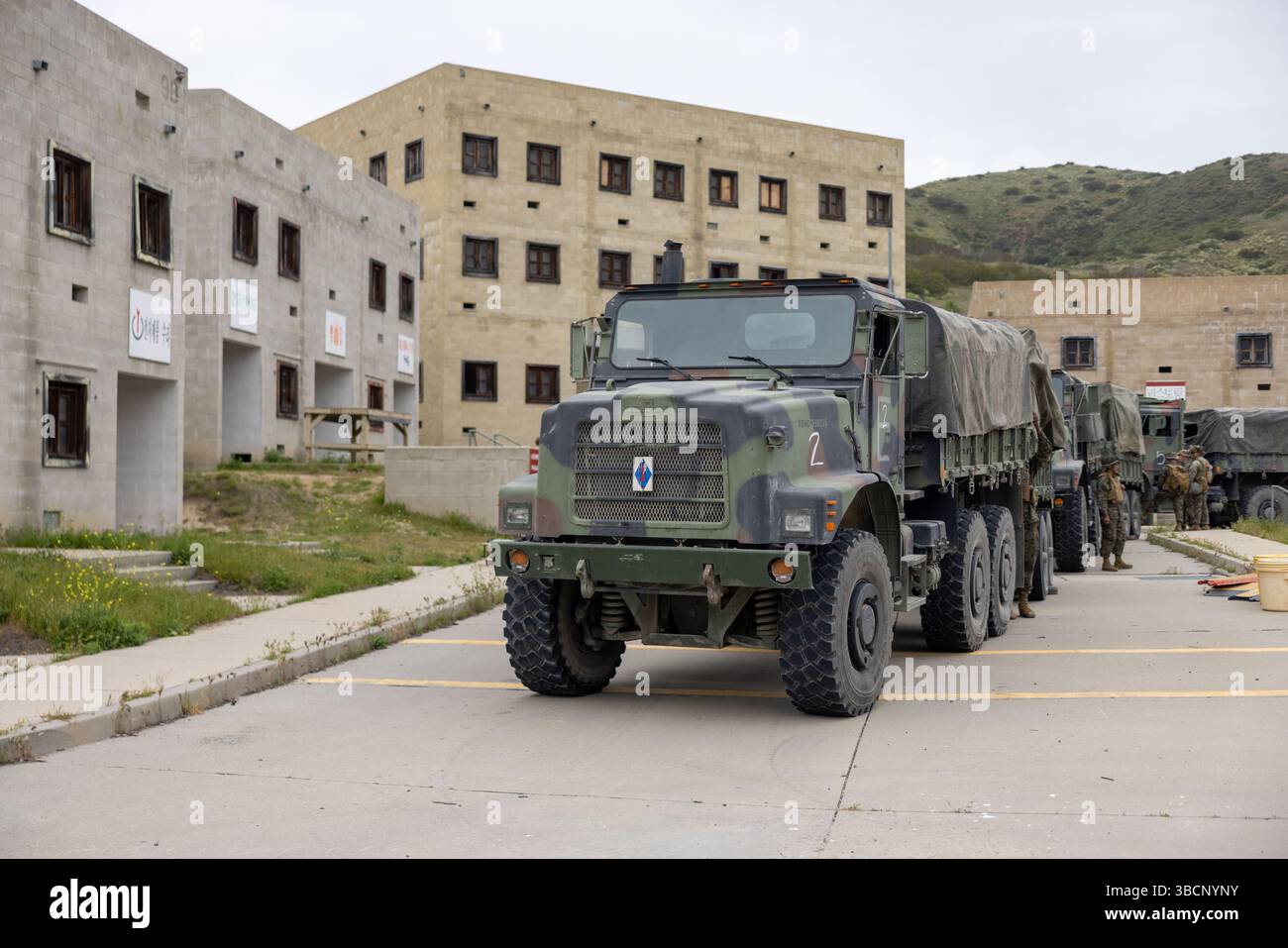 U.S. Marines with 1st Marine Division arrive at a secondary location ...