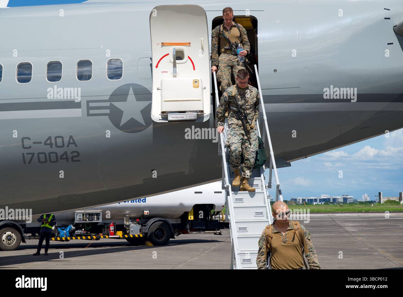 U.S. Marines with Marine Rotational Force – 25.3 step off a C-40A ...