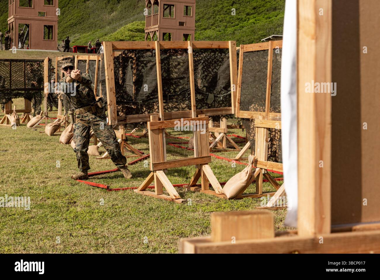 A U.S. Marine walks through a shooting stage during an intramural ...