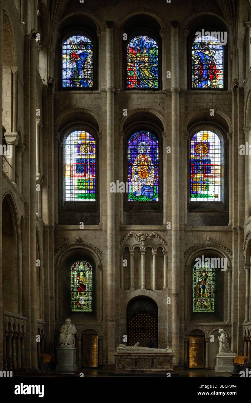 Stained glass windows, statues and tomb in the interior of Norwich ...
