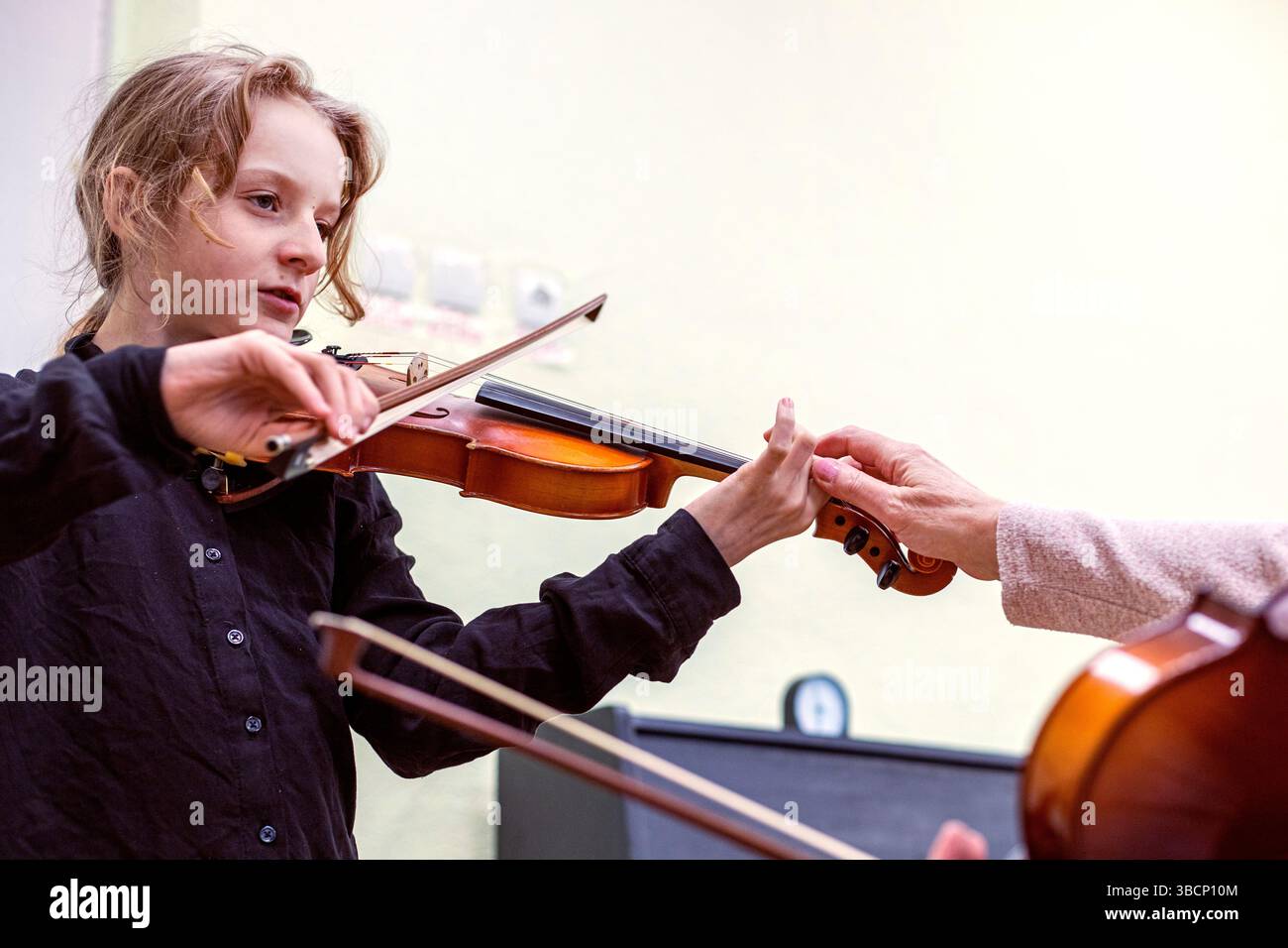 correction of finger placement on the fingerboard while playing the ...