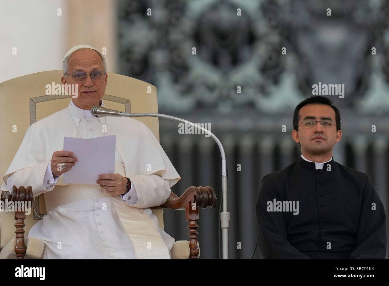 Pope Leo XIV is flanked by Father Edgard Iván Rimaycuna Inga during his ...