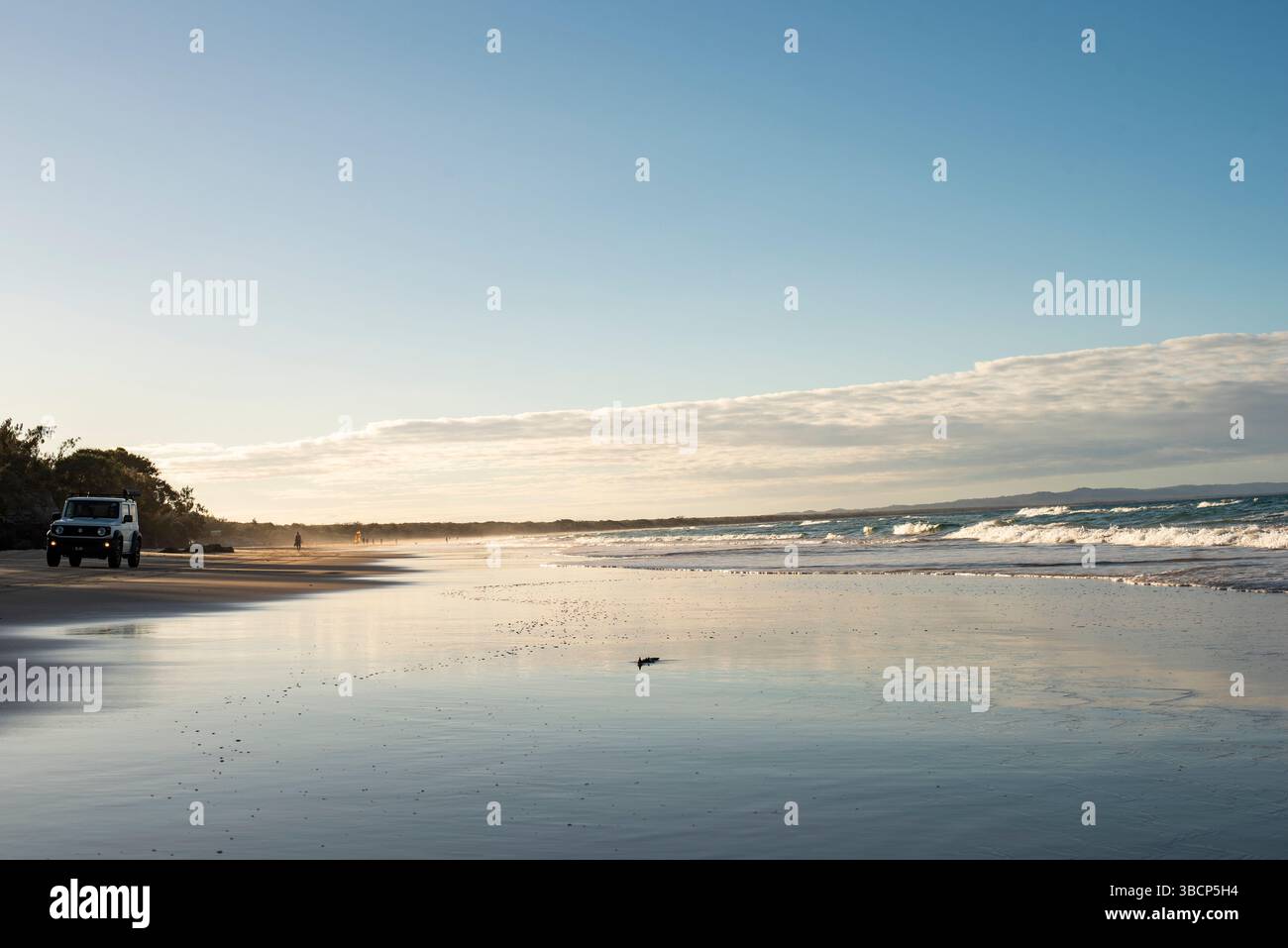 Rainbow beach at twilight Stock Photo - Alamy