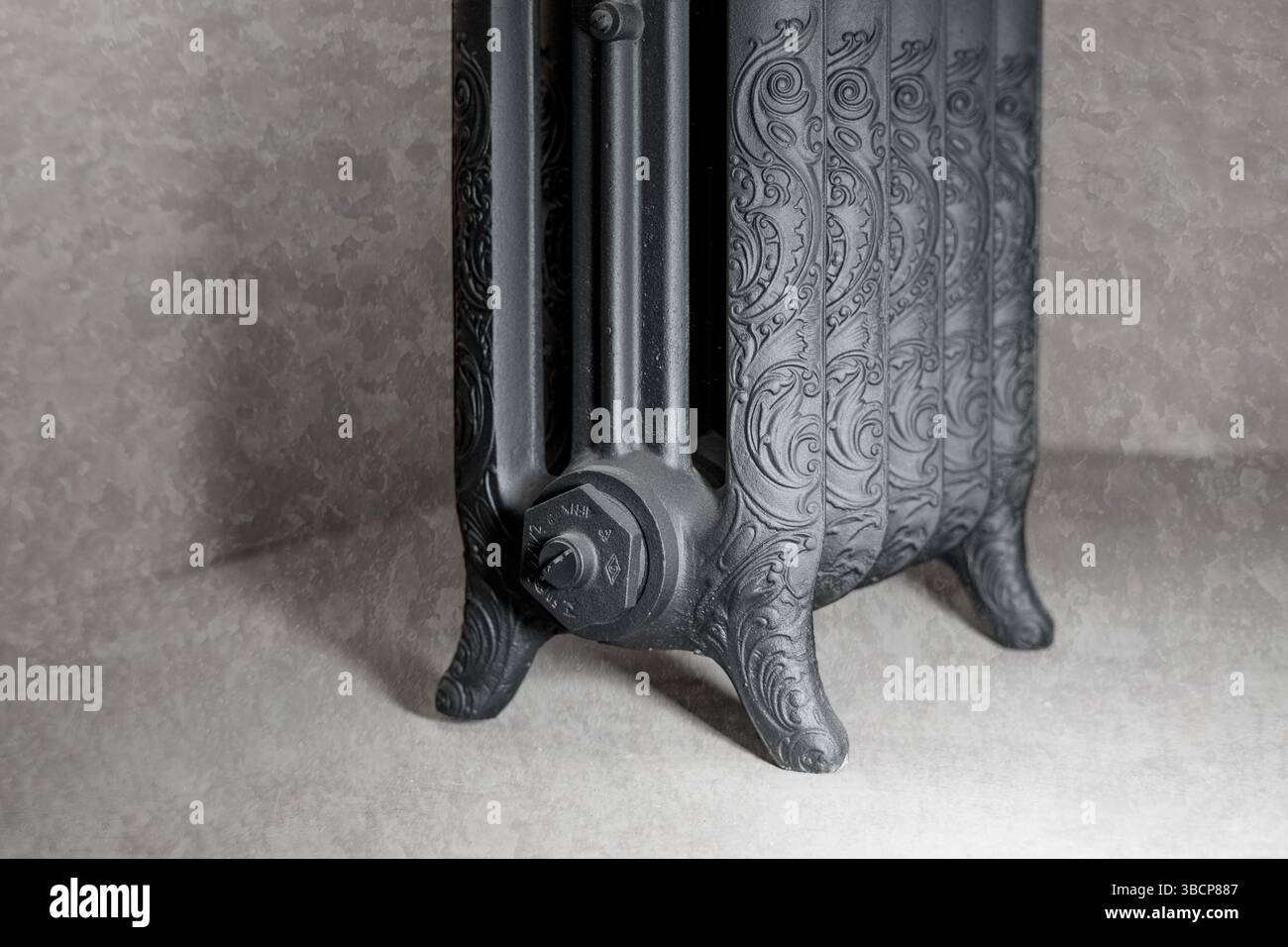 Rococo cast Iron radiator bottom view Stock Photo - Alamy
