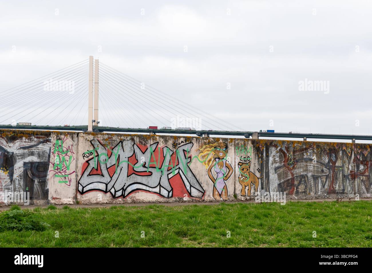 Graffiti along the Thames Path sea wall in the industrial area of West ...