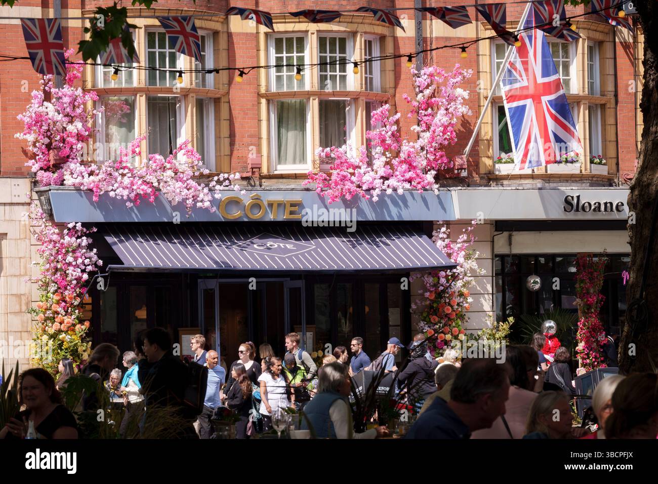 Flowers and a union jack flag at the Sloane Square Hotel during the ...