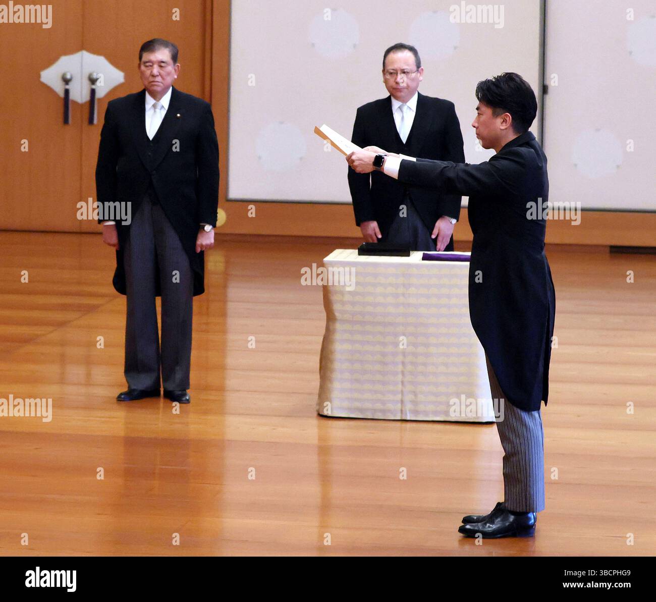 Japanese newly appointed Agriculture Minister Shinjiro Koizumi (R ...