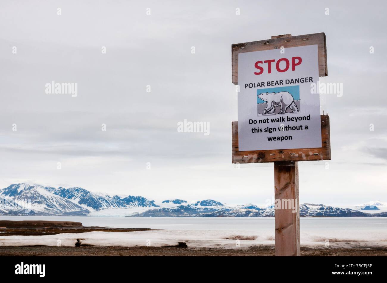a danger sign warning of polar bears at the research station of Ny ...