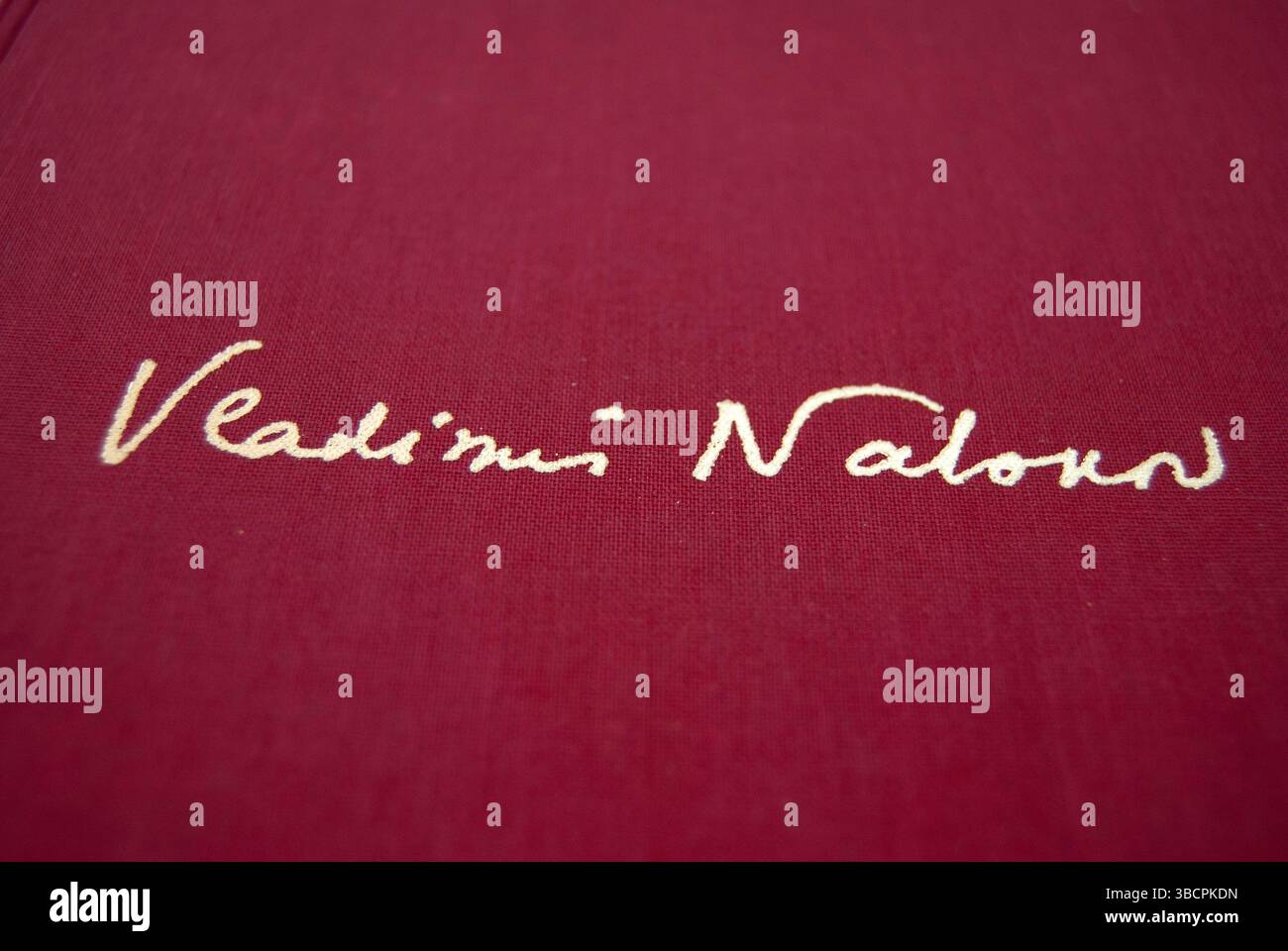 Vladimir Nabokov's hand written name on a book. A red book with Nabokov ...