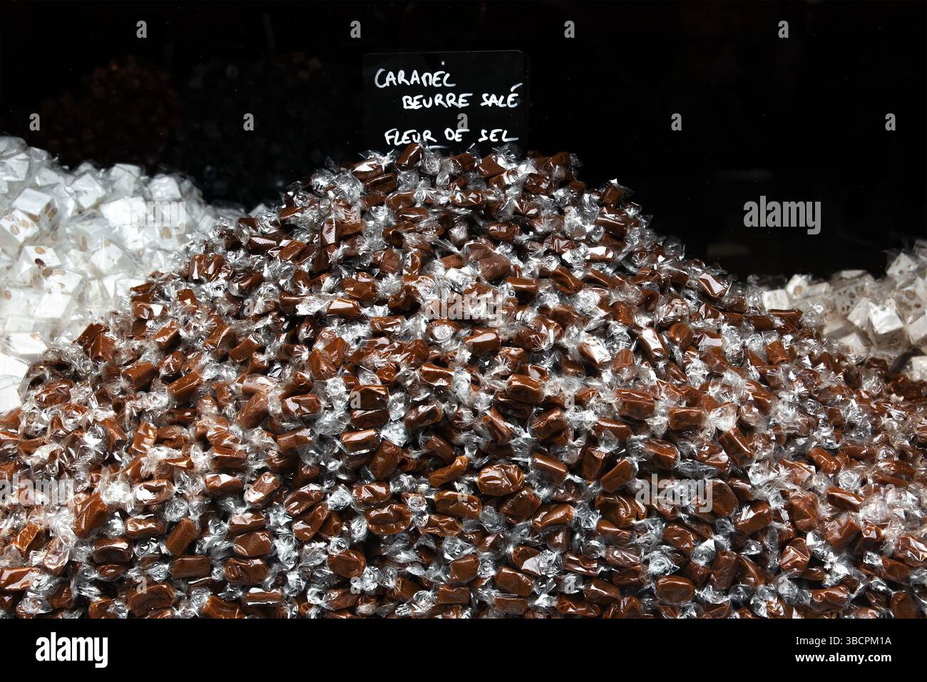 A confectionery display of a large pile of individually wrapped ...