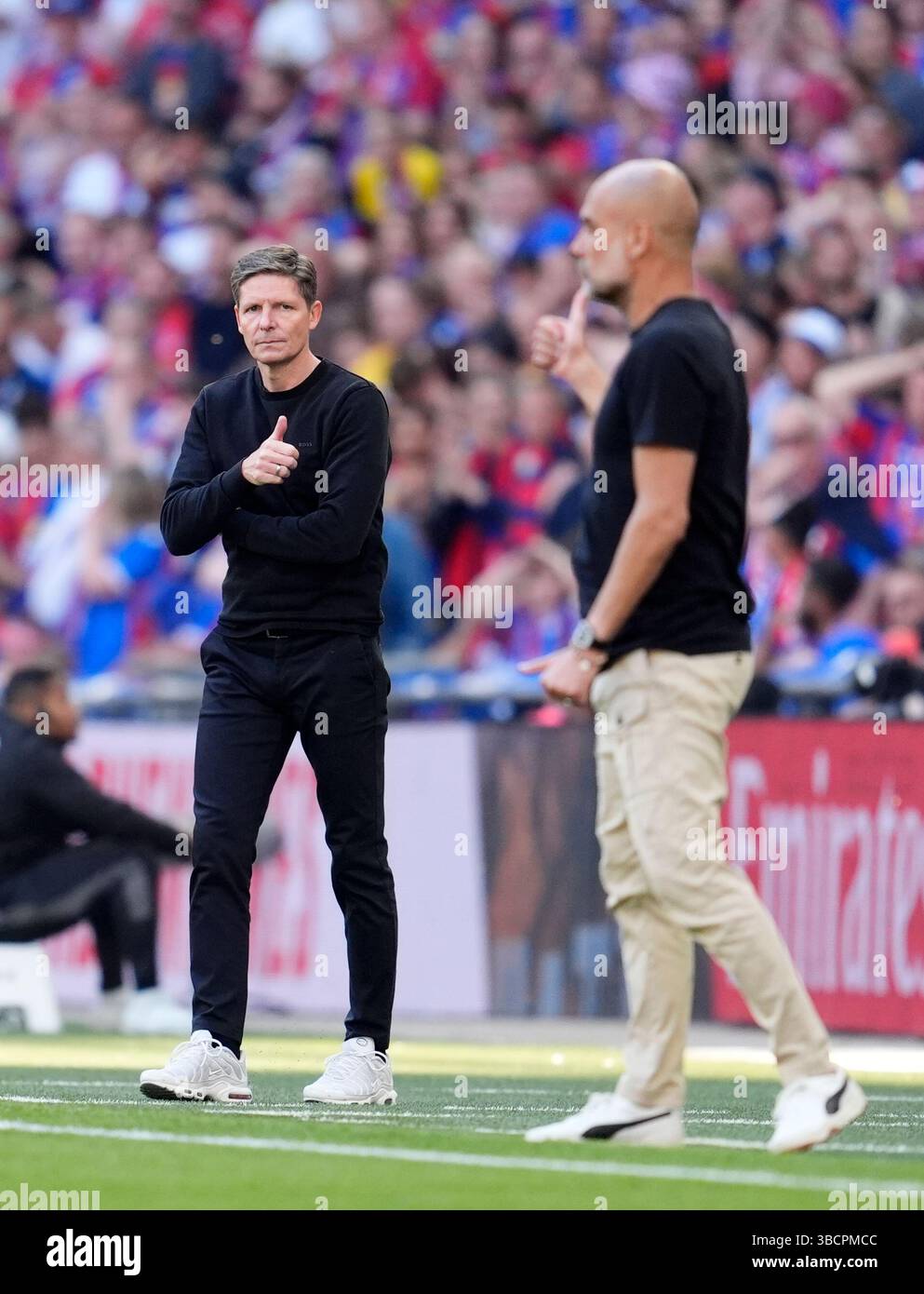 Crystal Palace manager Oliver Glasner (left) and Manchester City ...