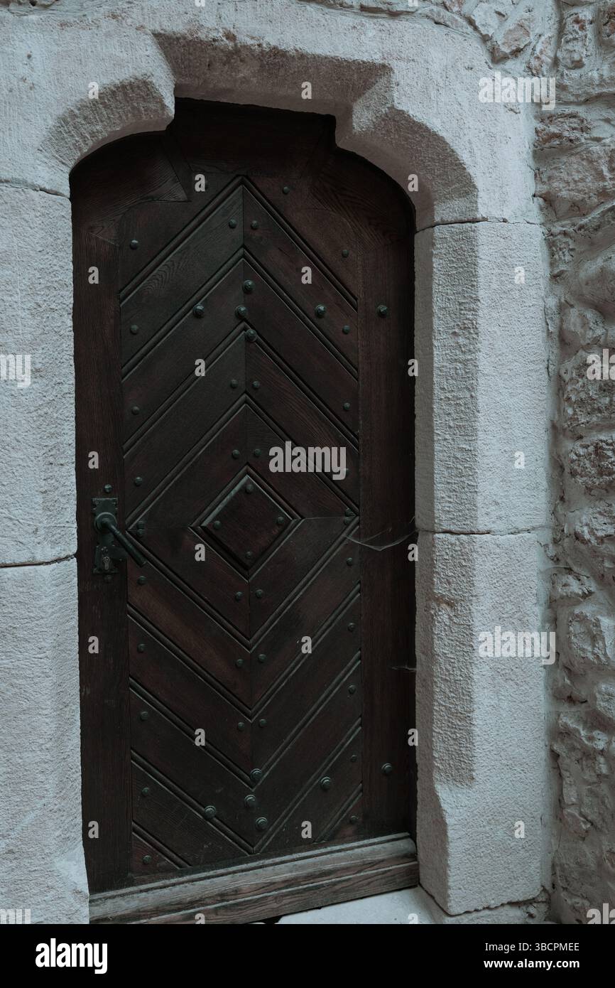 Old Wooden Door with Diagonal Planks and Stone Frame in Historic ...