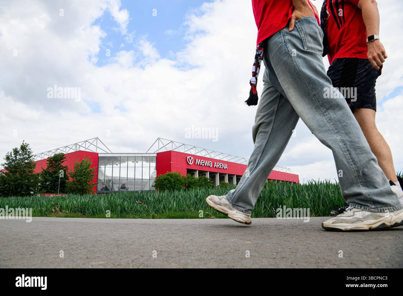 MAINZ, GERMANY - 17 MAY, 2025: Football fans walk toward MEWA ARENA ...