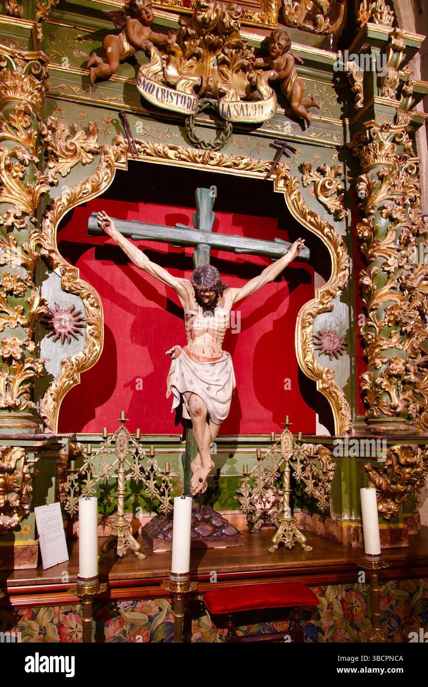 Altar with Jesus Christ crucified in the Roman catholic iglesia de San Martín Plaza Mayor ...