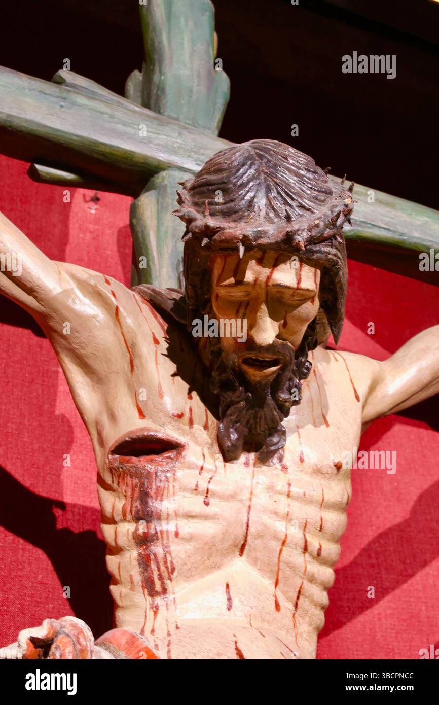 Altar with Jesus Christ crucified in the Roman catholic iglesia de San Martín Plaza Mayor ...