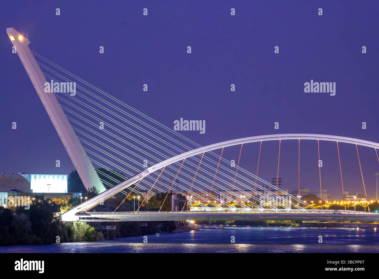 The illuminated Barqueta and Alamillo bridges enhance Seville's skyline ...