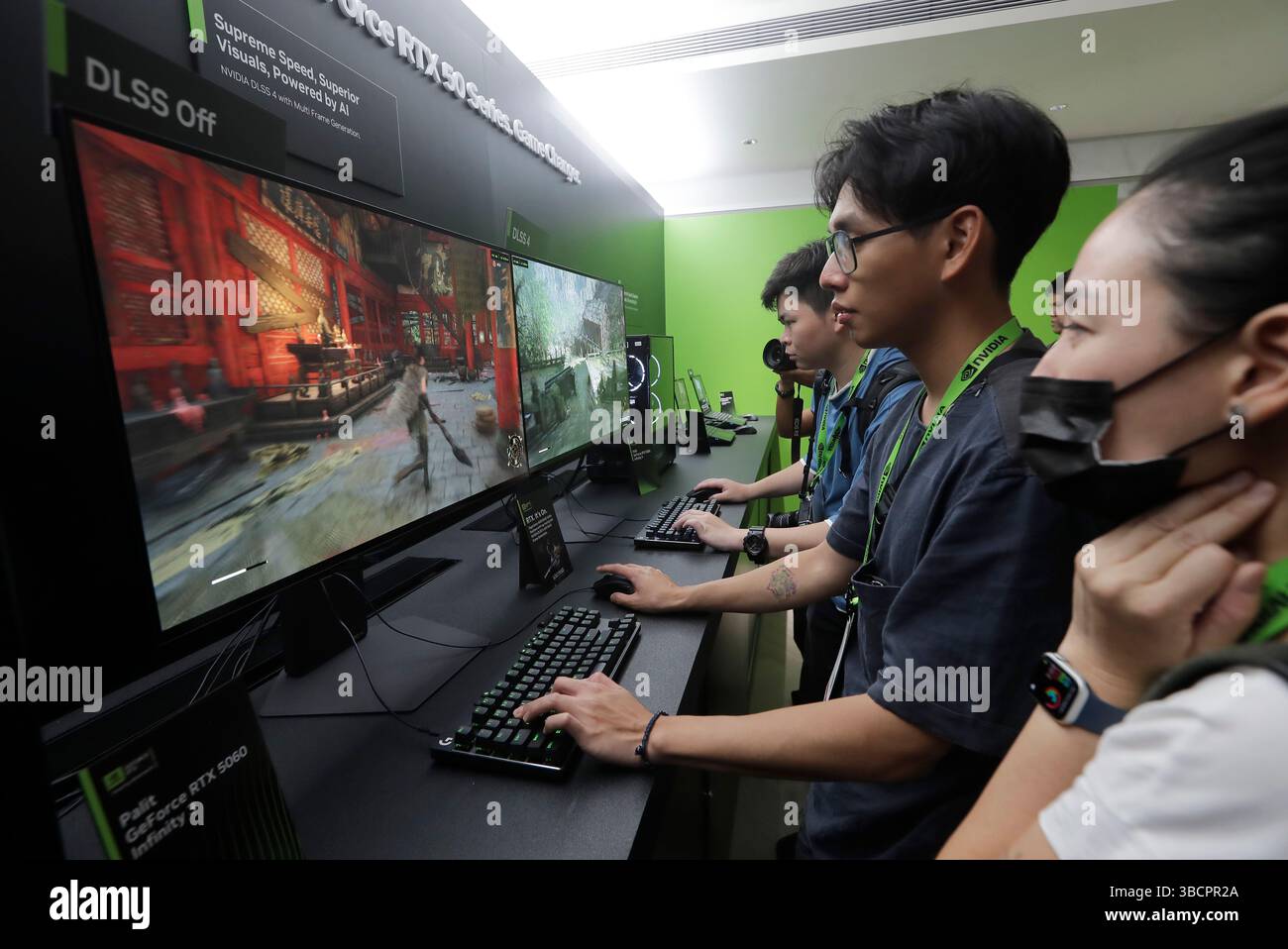 People experience the Nvidia GeForce RTX 50 Series during the Computex 2025 exhibition in Taipei ...