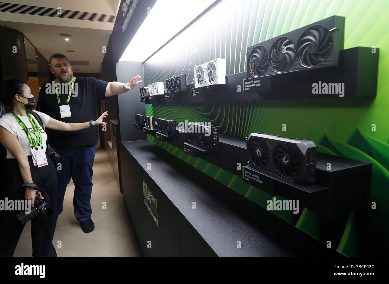 A Nvidia staff explains for gamers Nvidia Blackwell RTX 5060 during the ...