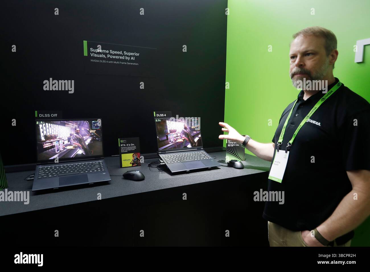 A Nvidia staff member explains the Nvidia GeForce RTX 5060 during the ...