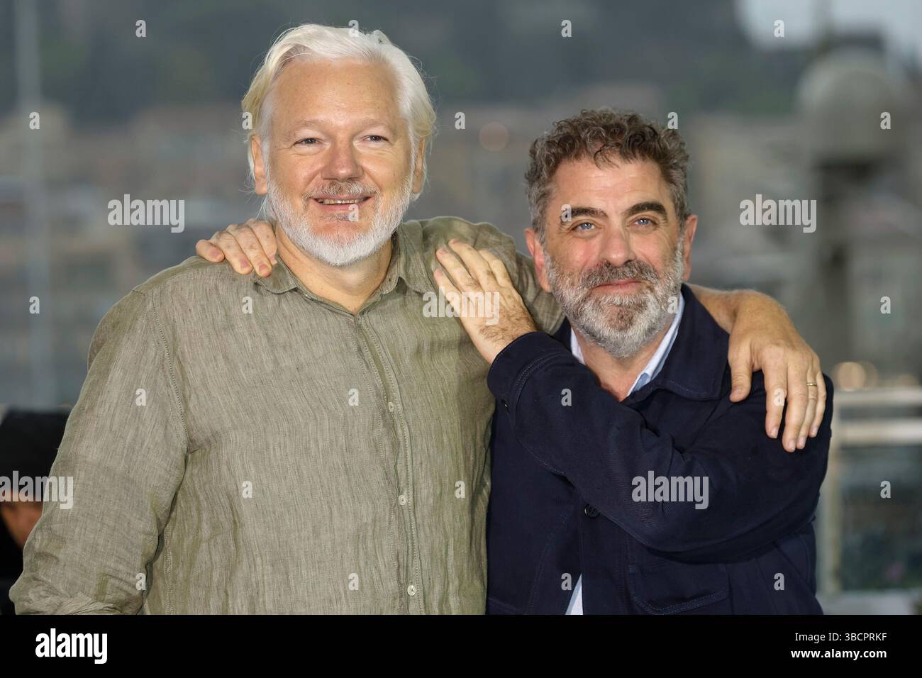 Julian Assange and Eugene Jarecki pose at the photocall of 'The Six ...