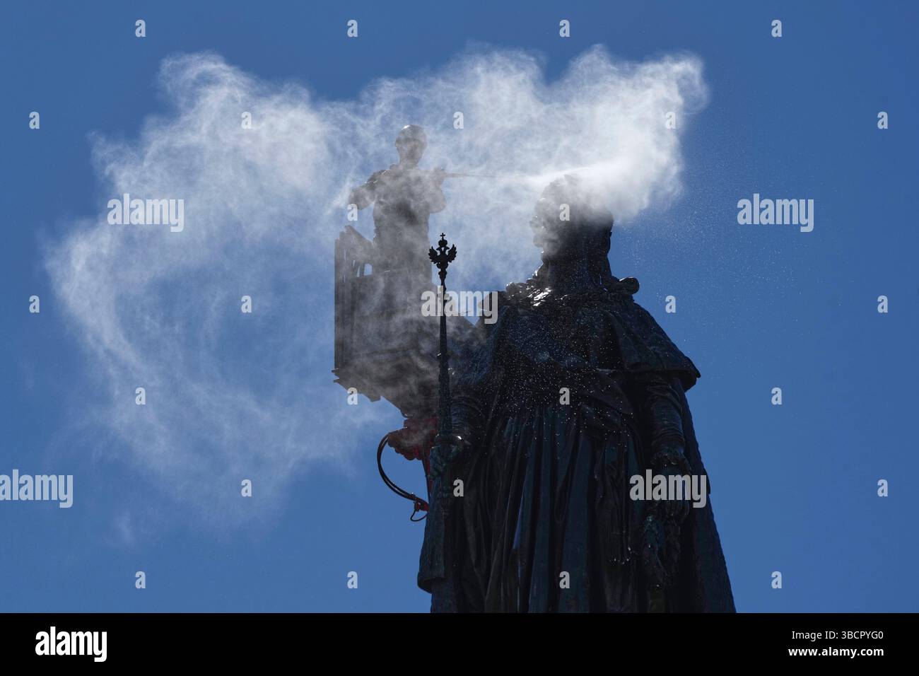 A worker washes the statue of Russian Tsarina Catherine the Great in St ...