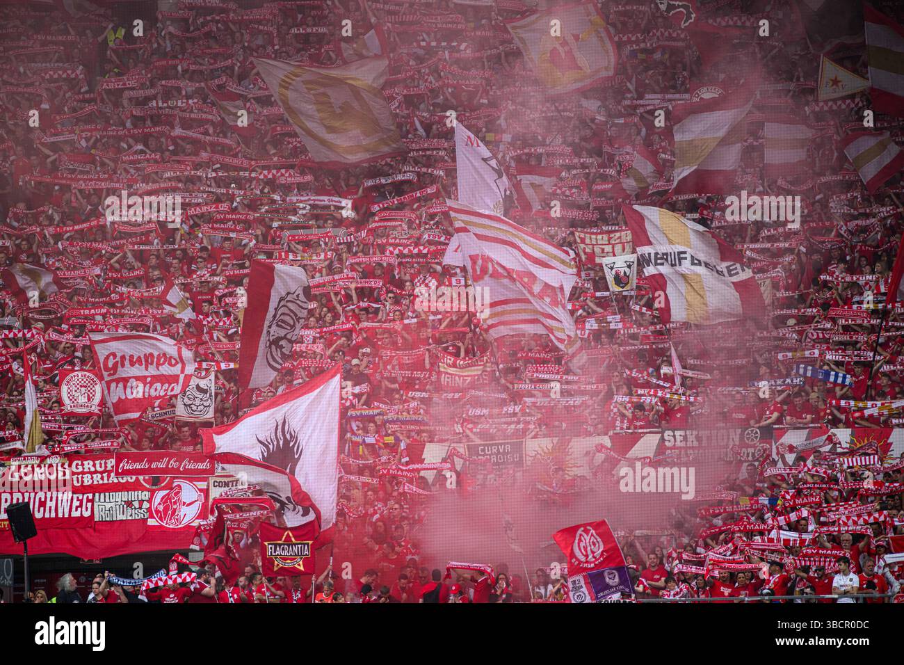 MAINZ, GERMANY - 17 MAY, 2025: Ultras of FSV Mainz 05 display flags and ...