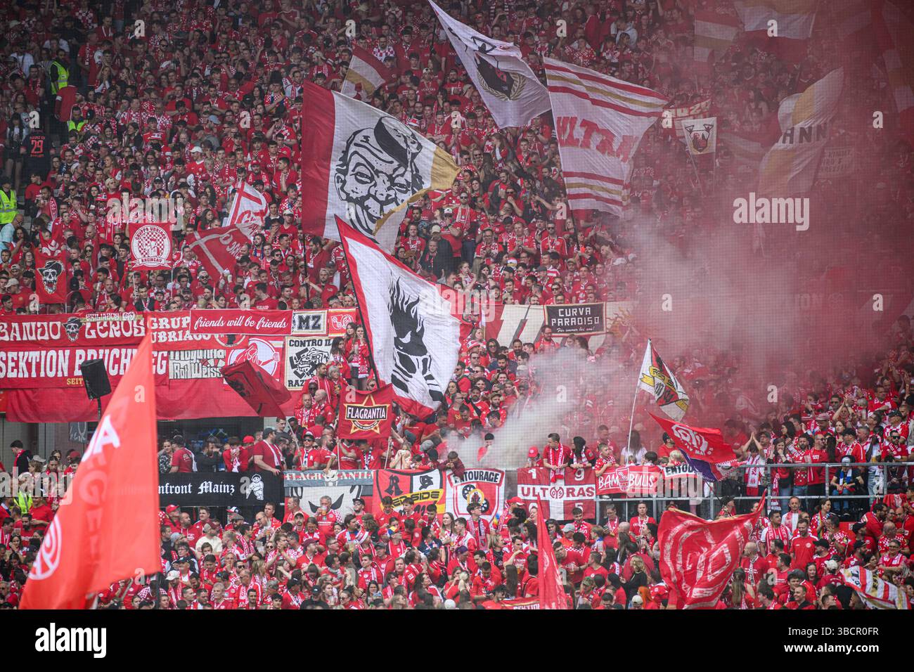 MAINZ, GERMANY - 17 MAY, 2025: Ultras of FSV Mainz 05 display flags and ...