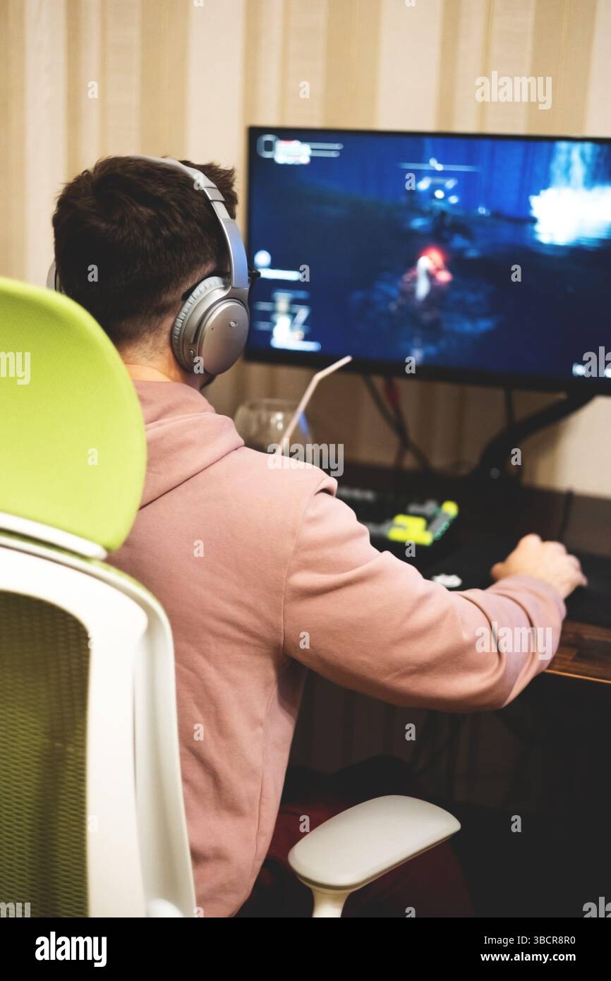 Asian guy playing pc game hi-res stock photography and images - Alamy