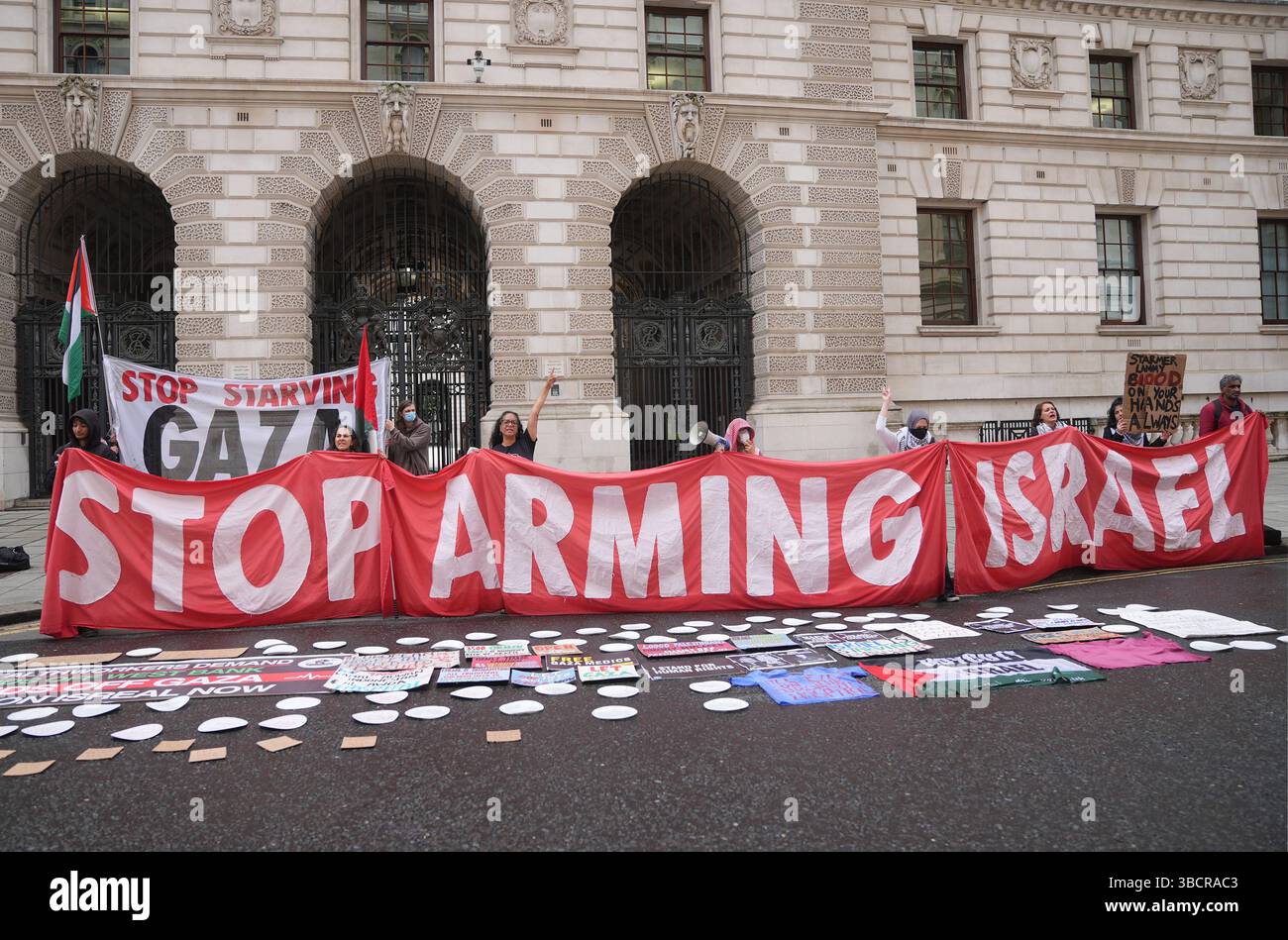 People taking part in a pro-Palestine demonstration outside the front ...