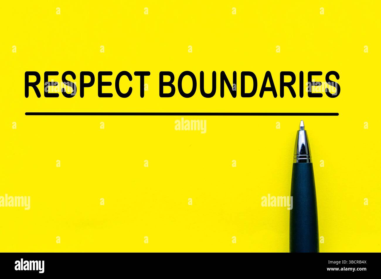 Respect boundaries text on yellow lines with pen representing awareness ...