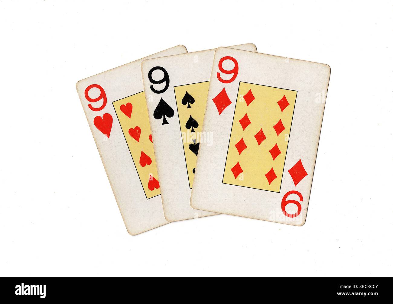 Vintage playing cards showing three of the same value isolated on a ...