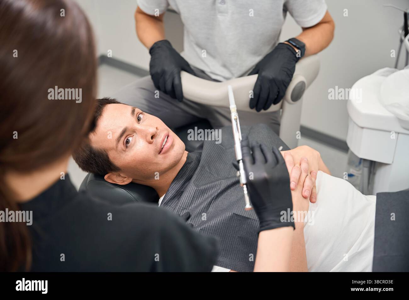 Woman dentist holding dental syringe with local anaesthetic Stock Photo ...