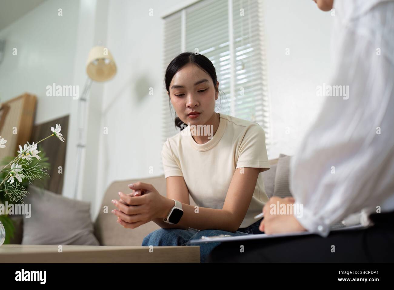 Psychologist and Patient. Focused therapy session on emotional well ...