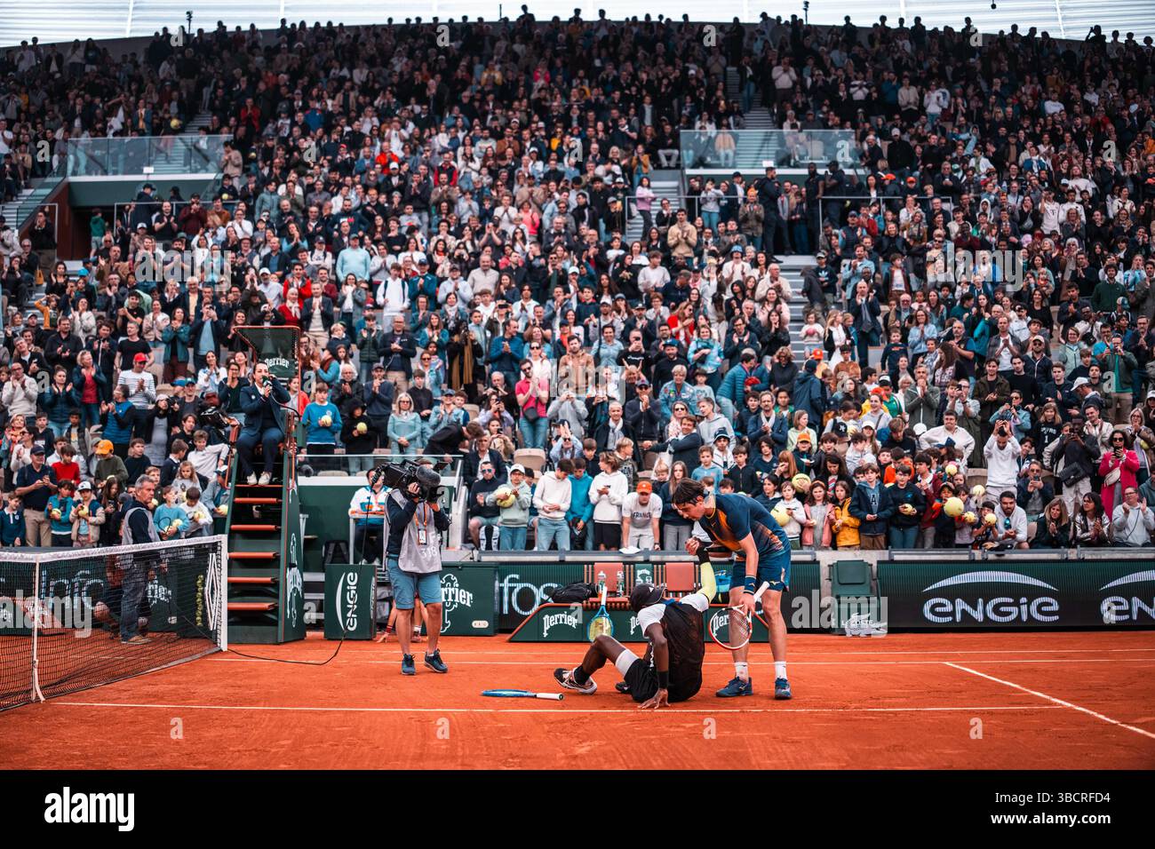 Alexander SHEVCHENKO of Kazakhstan helps Mathys ERHARD of France to ...