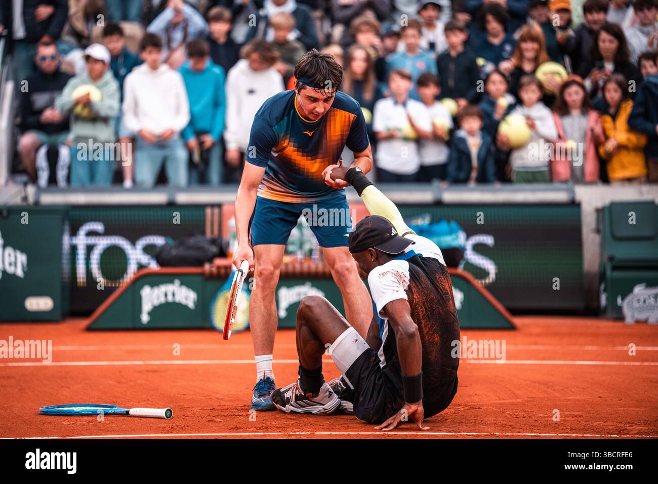 Alexander SHEVCHENKO of Kazakhstan helps Mathys ERHARD of France to ...