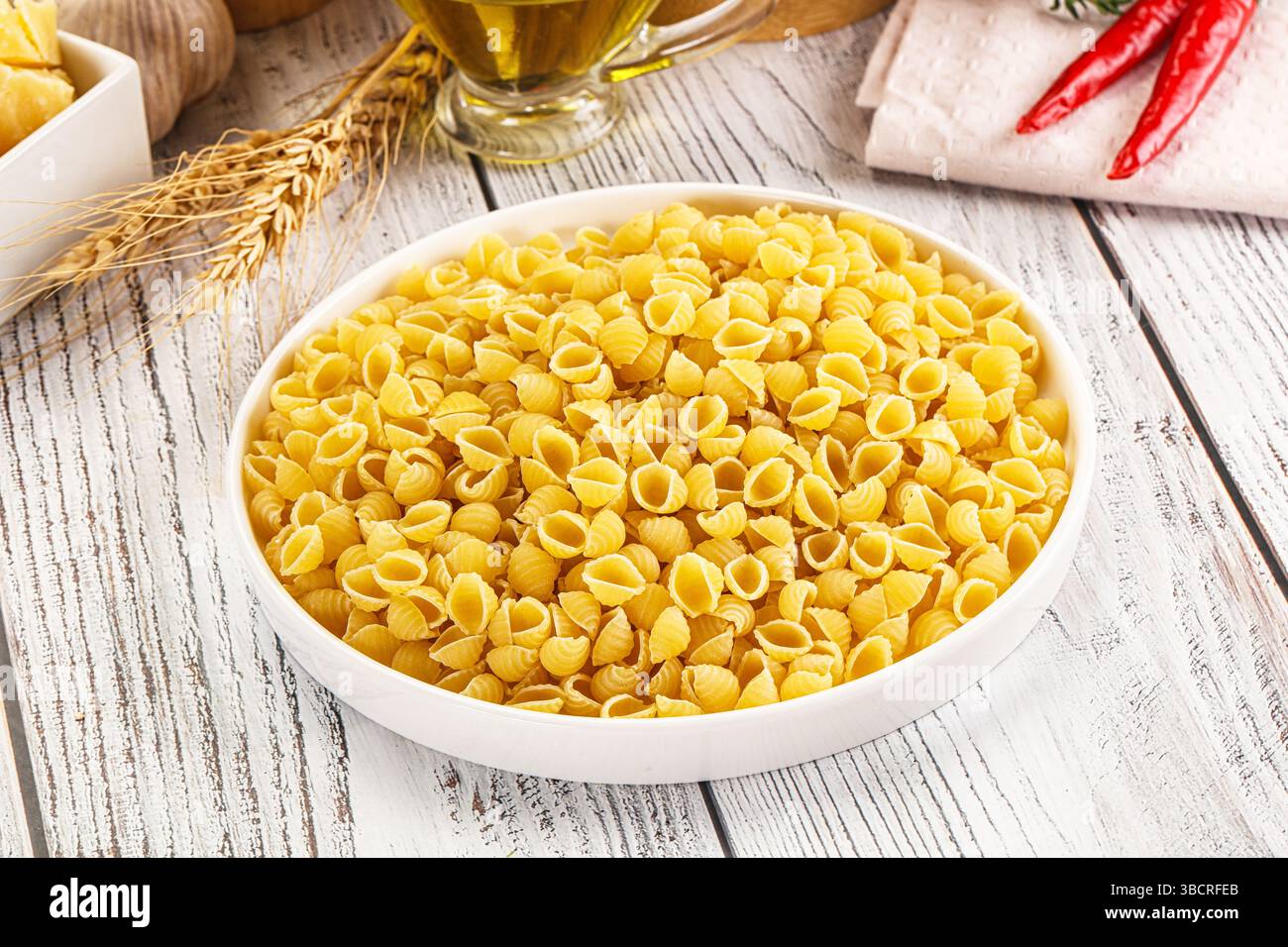 Italian cuisine - dry conchiglie shell pasta Stock Photo - Alamy