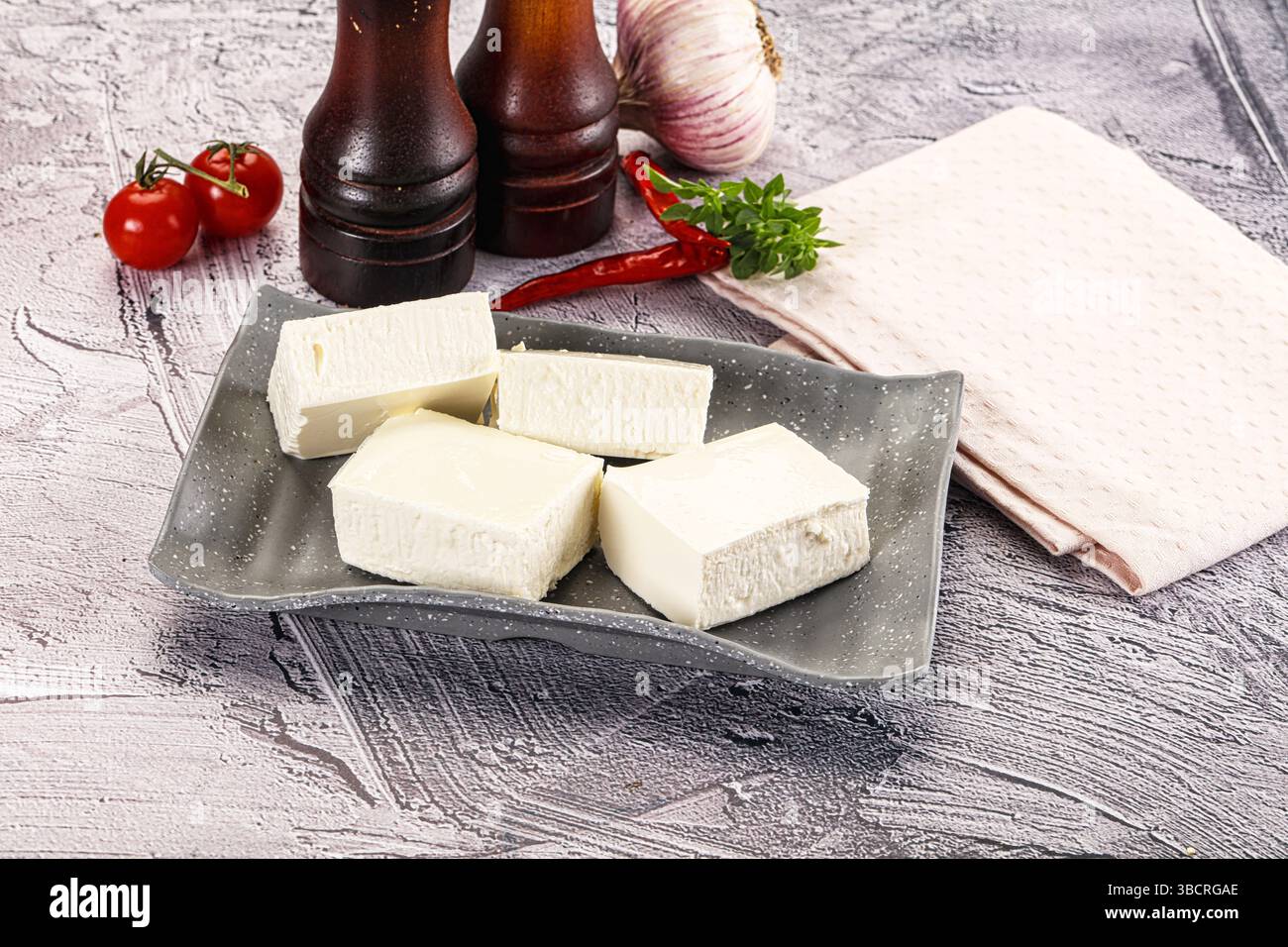 Greek traditional cuisine - Feta cheese bricks Stock Photo - Alamy