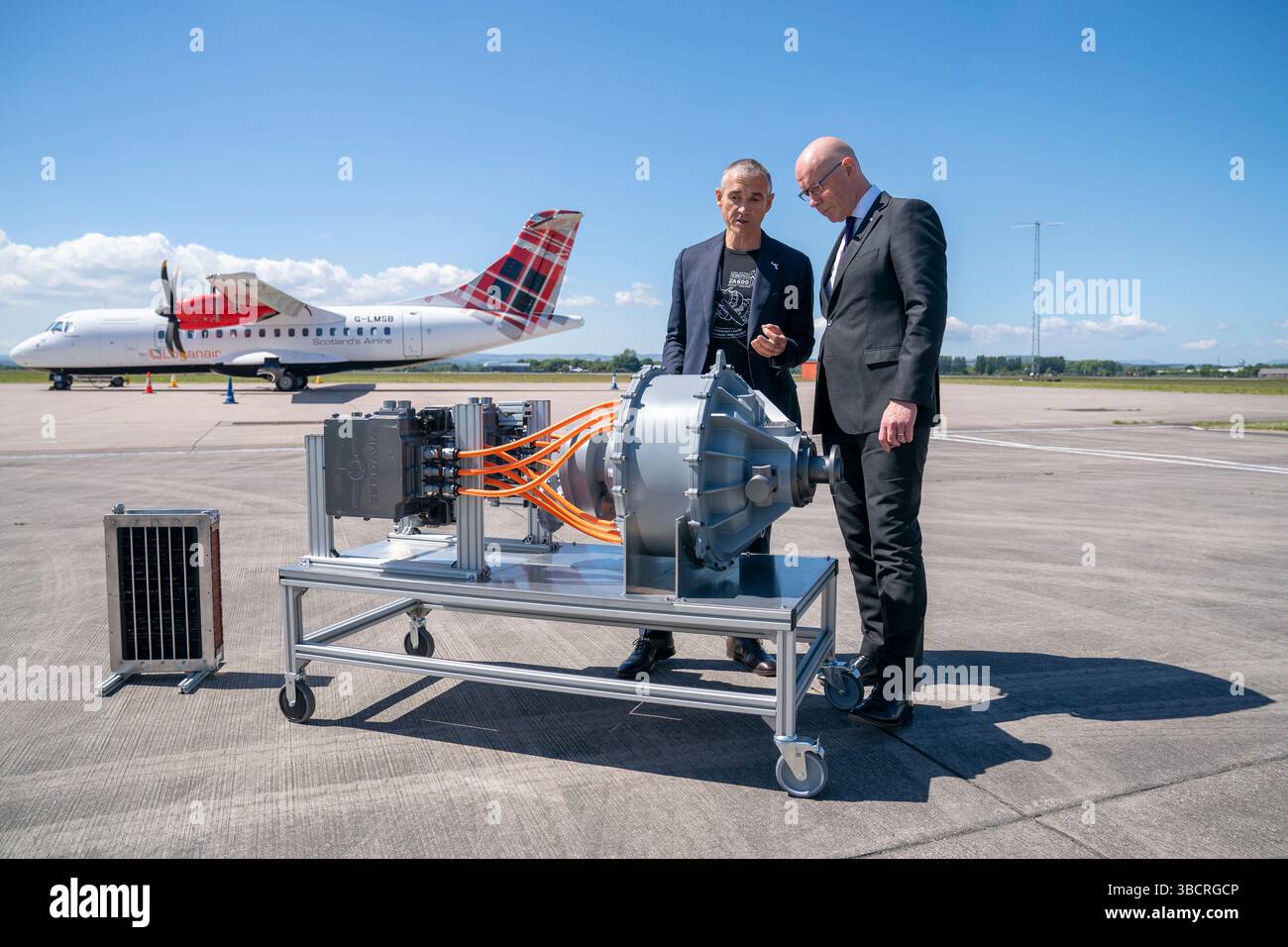 First Minister of Scotland John Swinney with the CEO and founder of ...