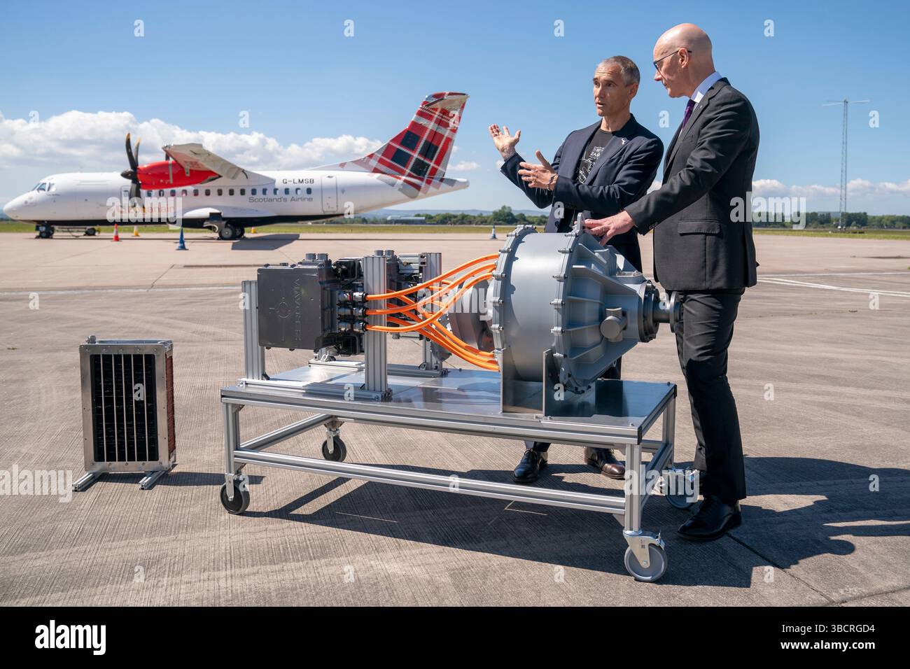 First Minister of Scotland John Swinney with the CEO and founder of ...